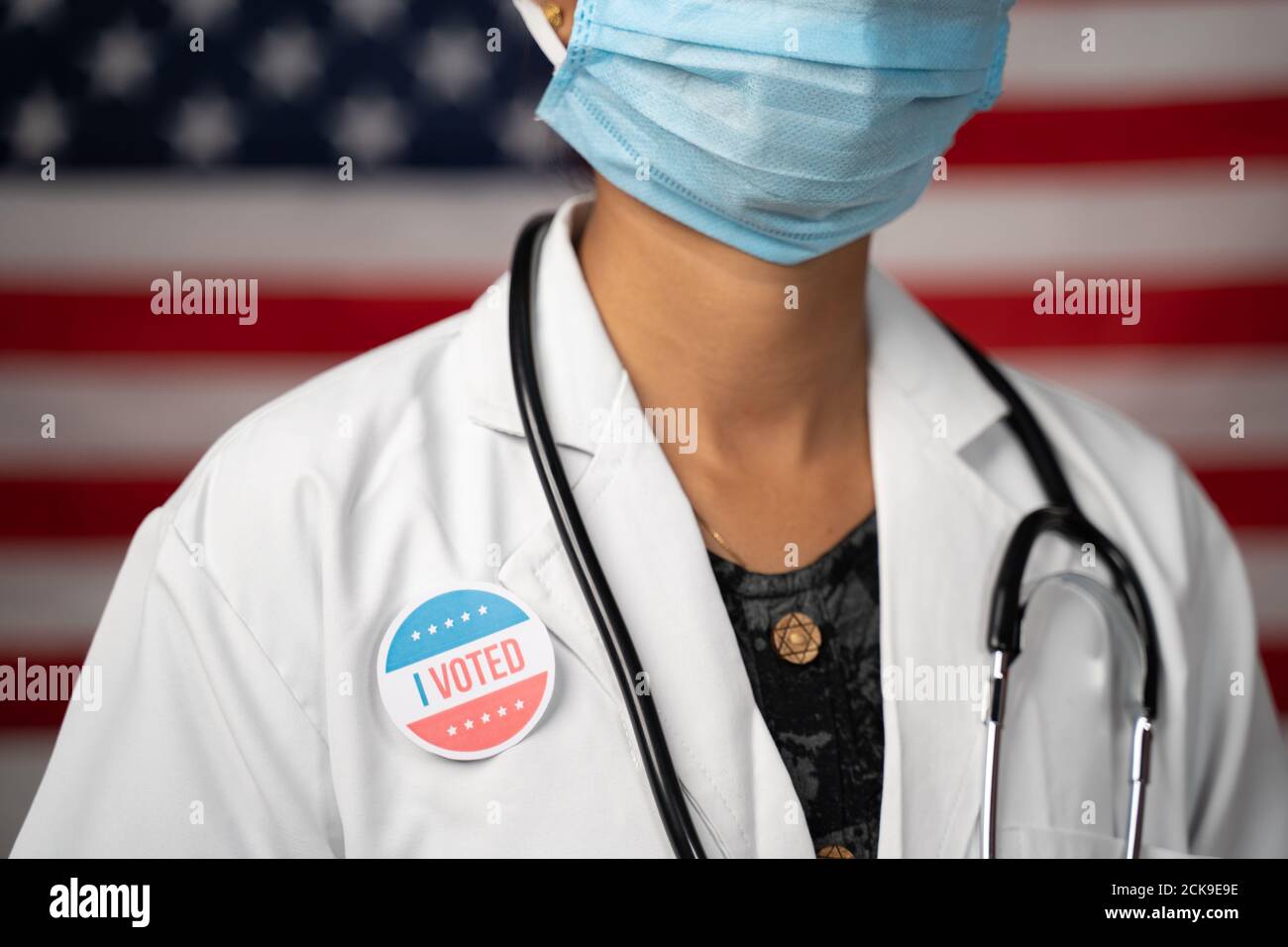 Doctor or nurse medical mask and stethoscope wearing placing I voted ...