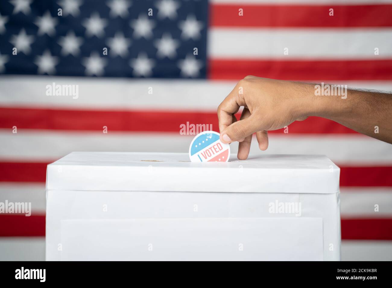 Concept of USA elections, Close up of Hands Putting I Voted sticker ...