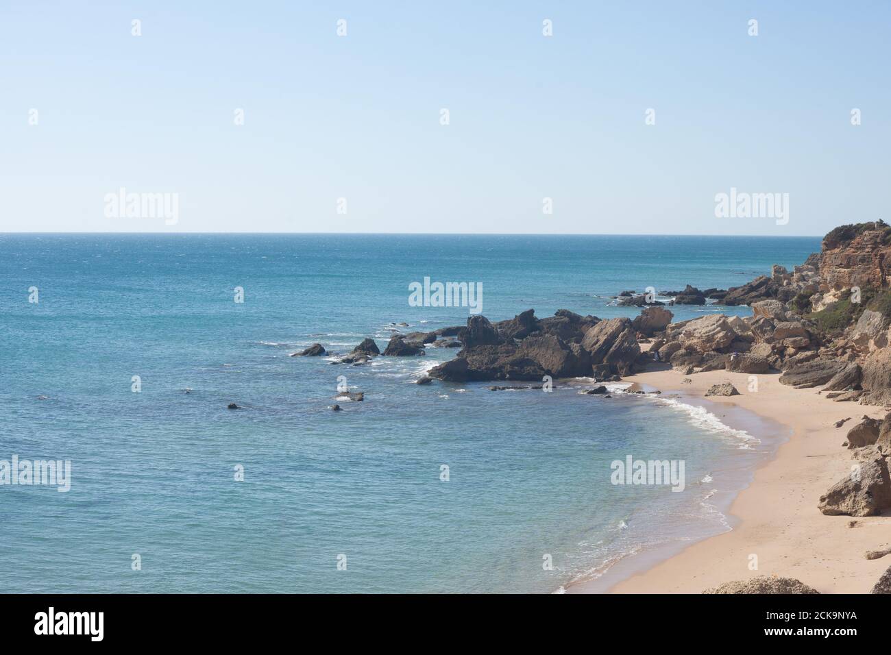 Beautiful view of a sandy shore with a clear skyline Stock Photo - Alamy