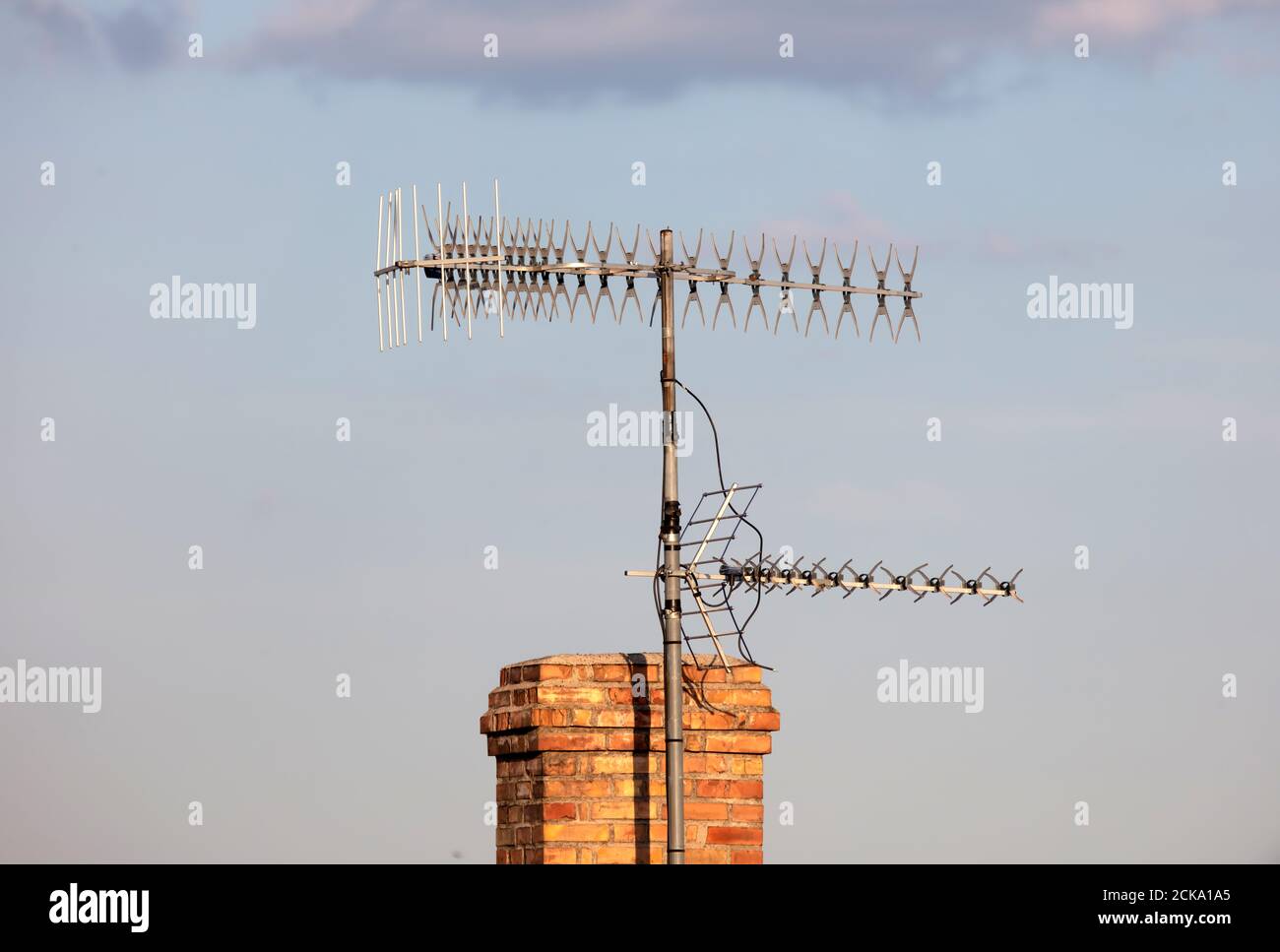 Old type antenna on the roof of house, brick chimney Stock Photo - Alamy