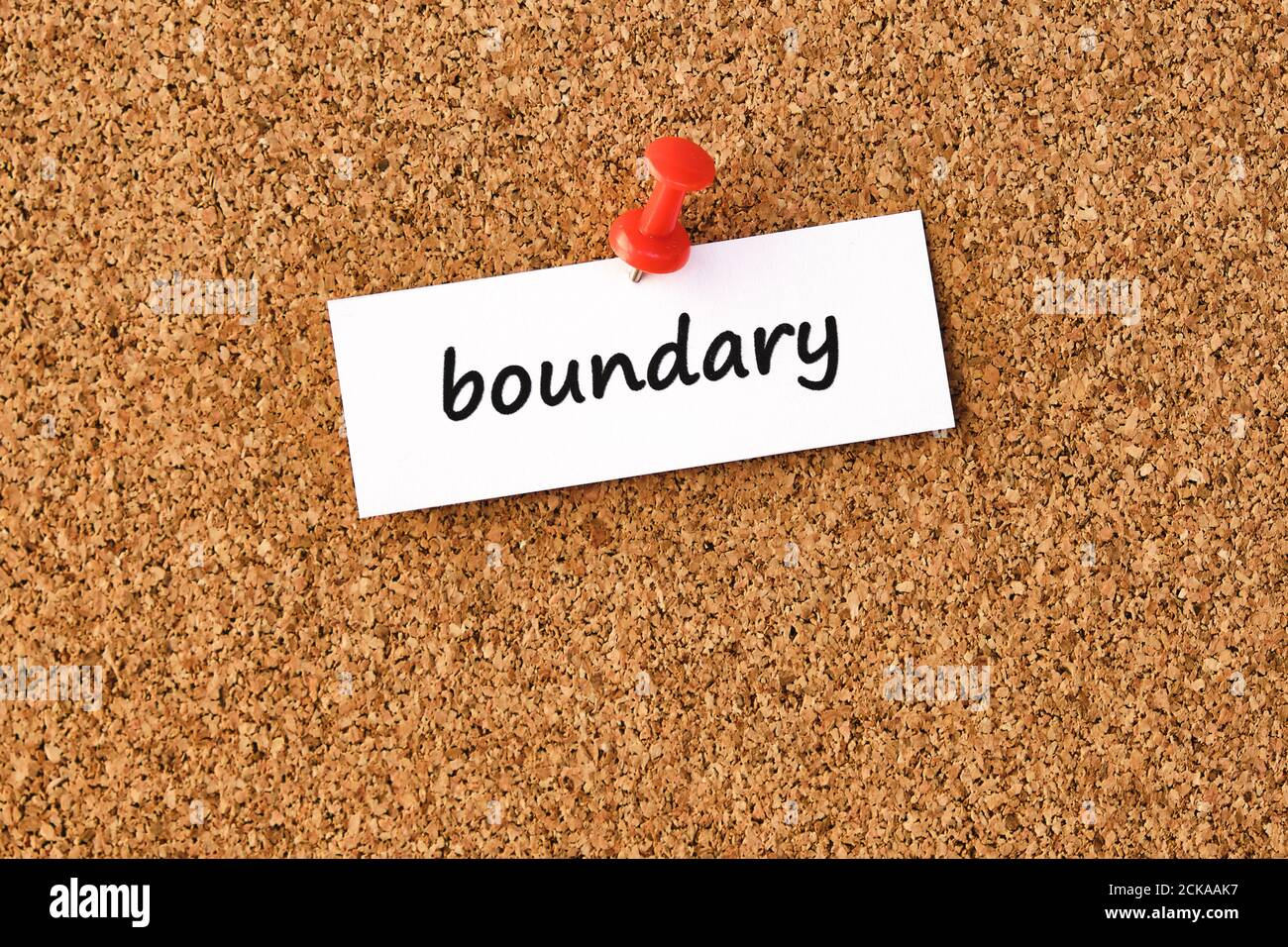 Boundary. Word written on a piece of paper or note, cork board ...