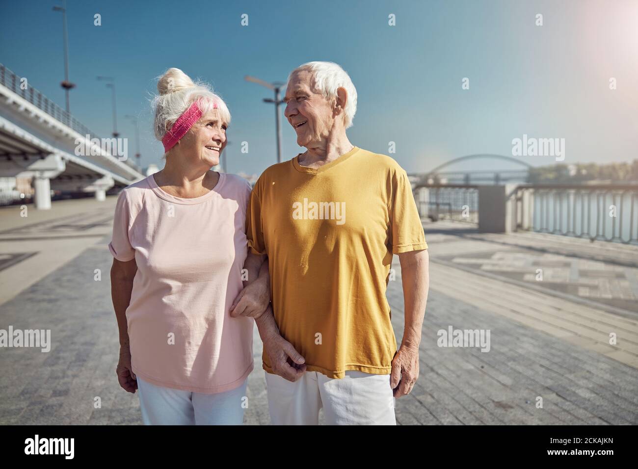 Two senior people smiling at each other Stock Photo - Alamy