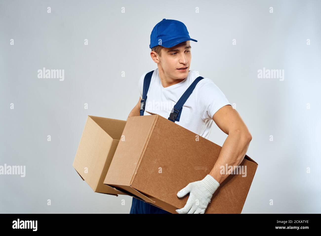 Man worker with box in hands delivery loading service packing service ...