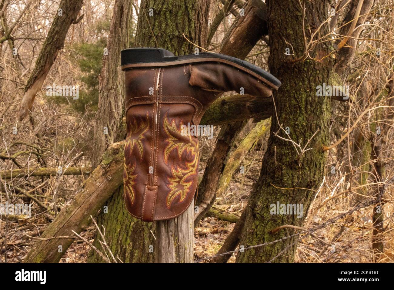 Cowboy boot on fence hi-res stock photography and images - Alamy