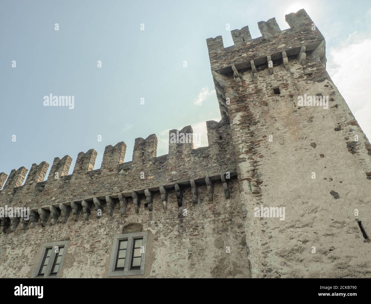 defensive tower of the old Italian castle with battlements that protect ...