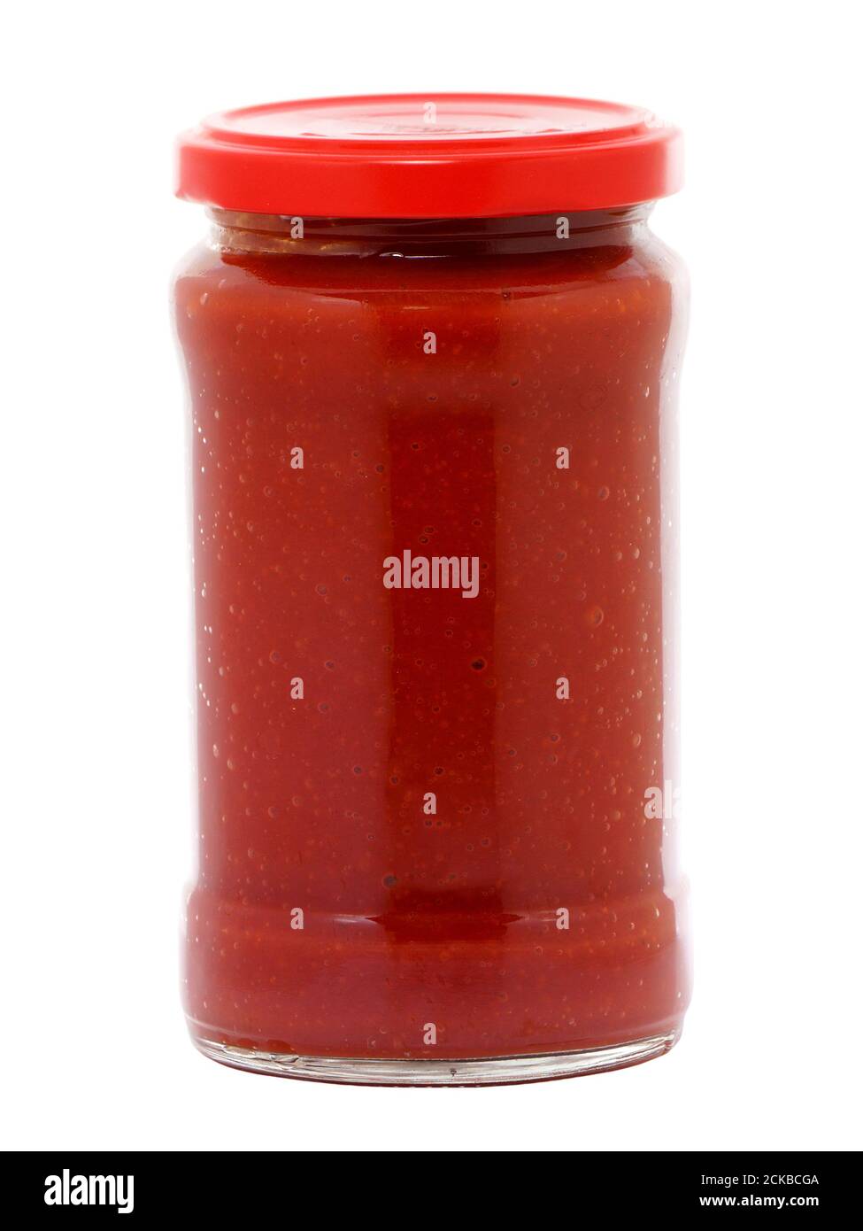 Tomato paste in a glass jar isolated on white Stock Photo - Alamy