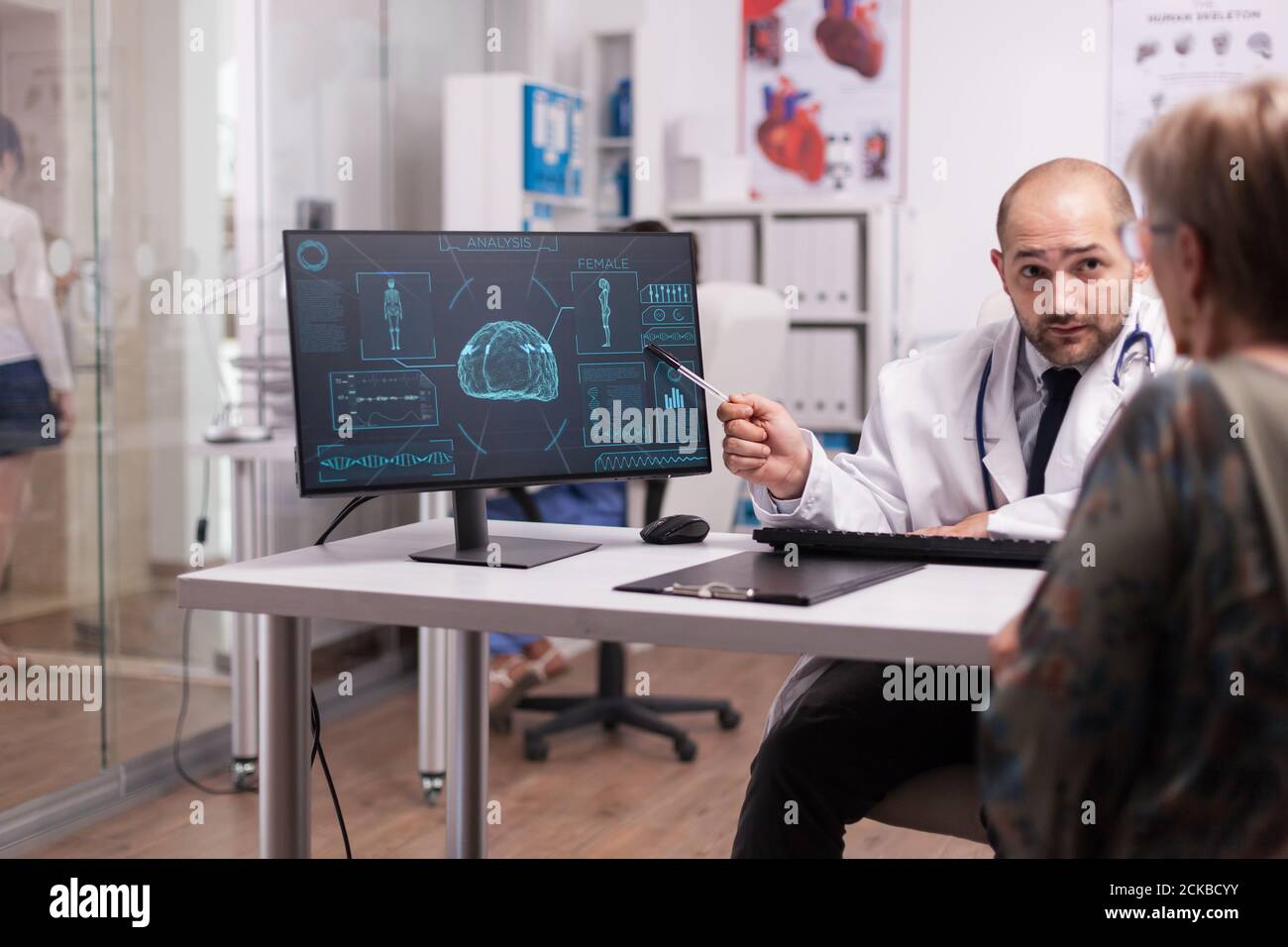 Doctor explaning mri for elderly aged patient with severe brain illness ...