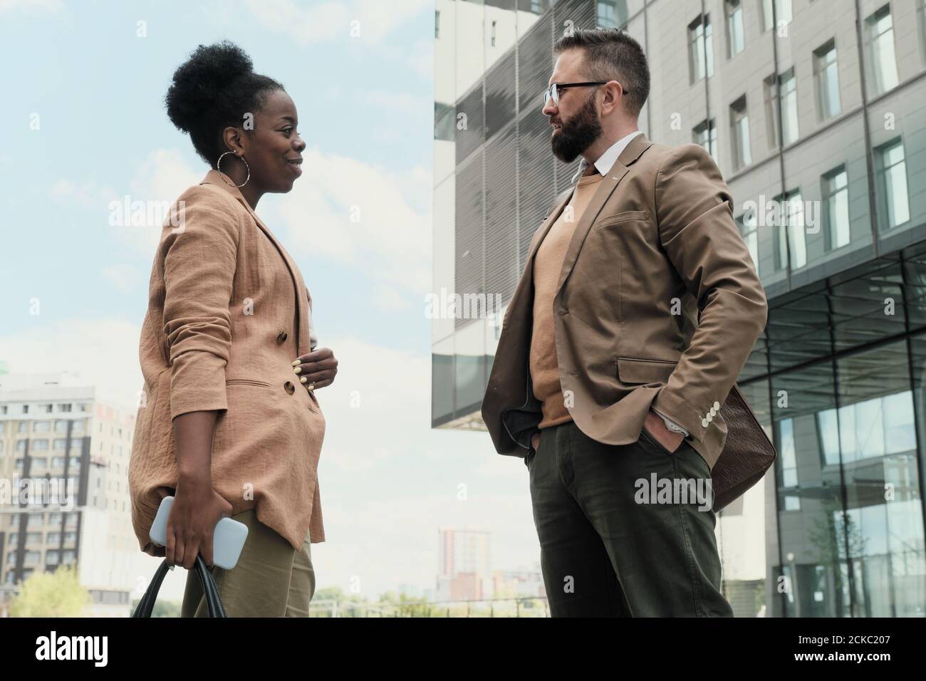 Using mobile talking other two hi-res stock photography and images - Alamy