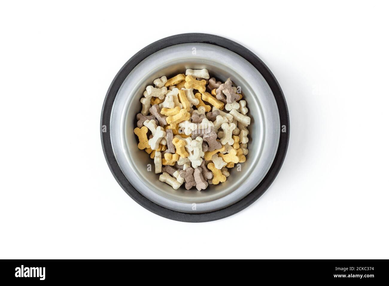 Heap of dog's food in a plate isolated on white background top view ...