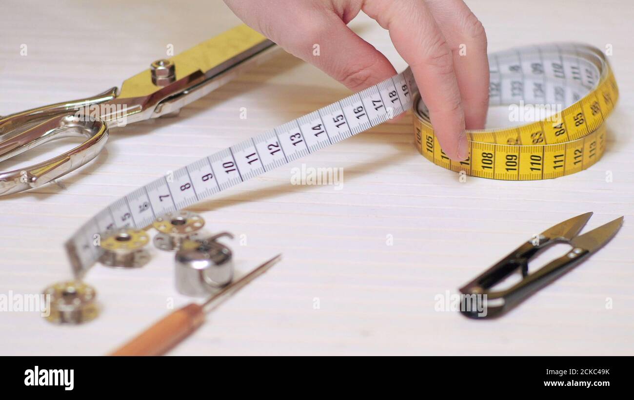Tailor tools isolated on wooden background. Scissors, needle, Tailoring ...