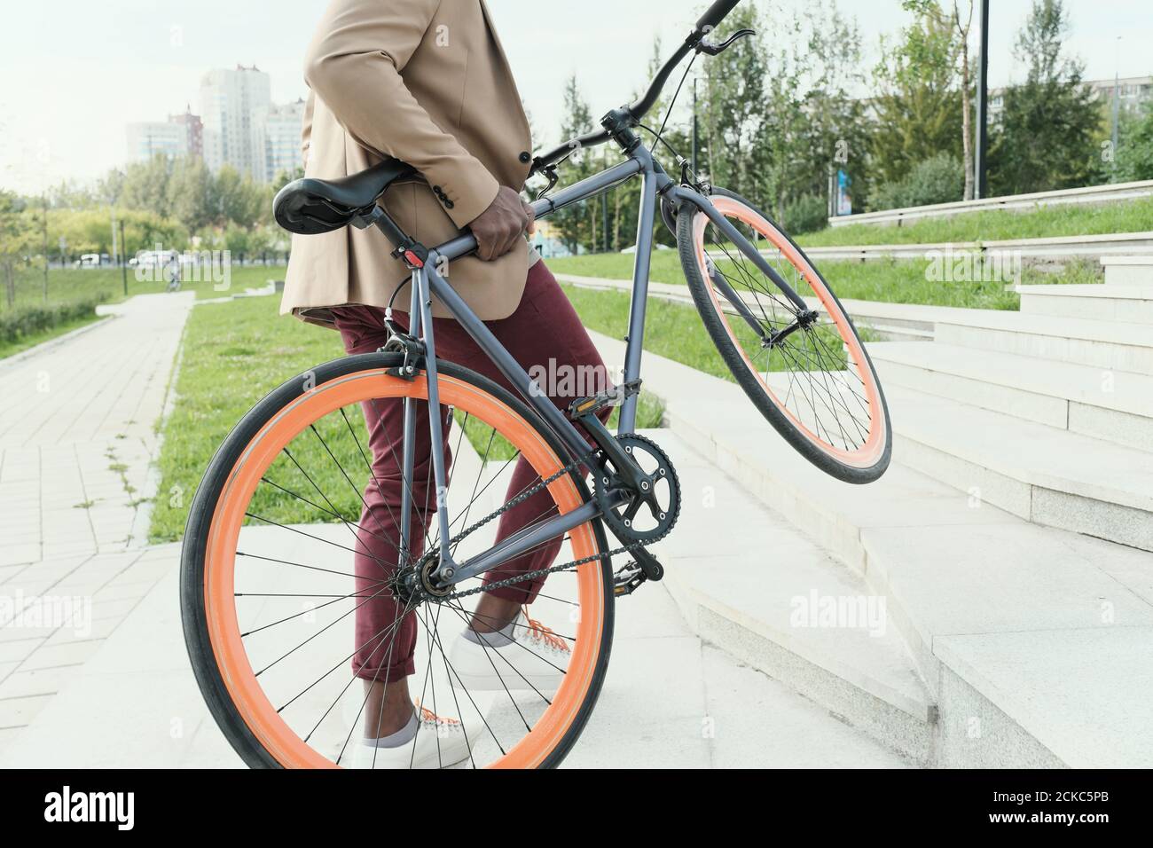 Businessman cycling in park hi-res stock photography and images - Alamy