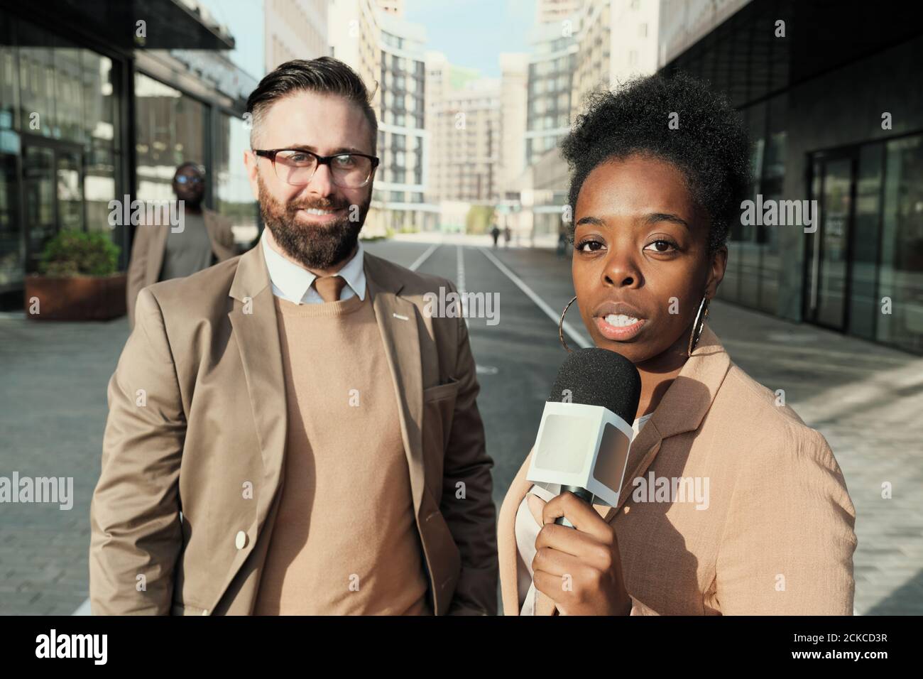 Standing communication reporter holding microphone hi-res stock ...