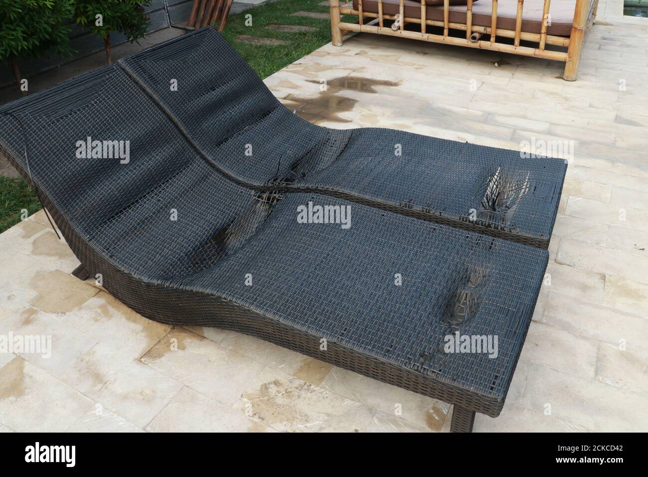 black wicker sun bed isolate with clipping path. old sunbeds in the ...