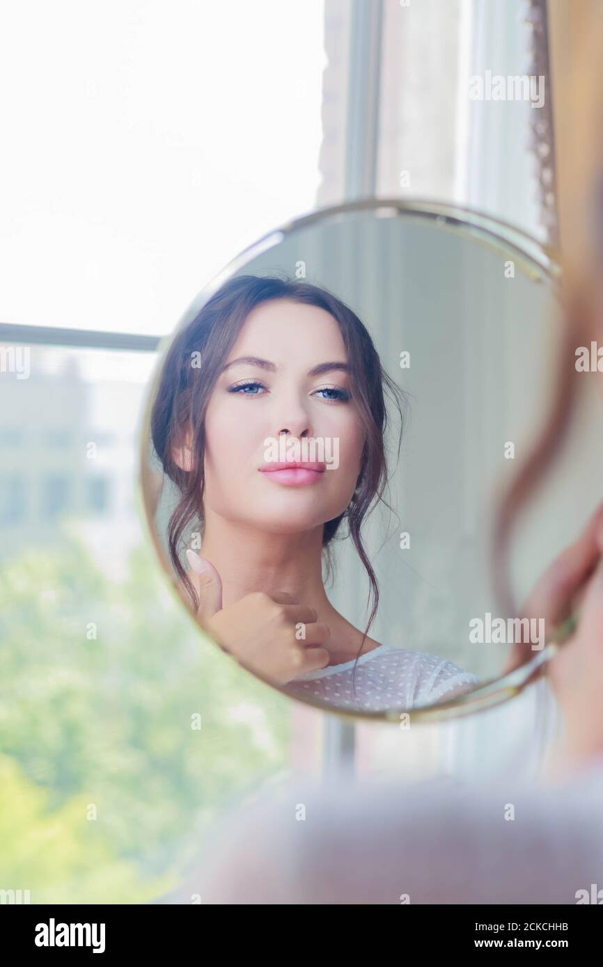 Portrait of the bride in a white wedding dress in a beautiful round ...