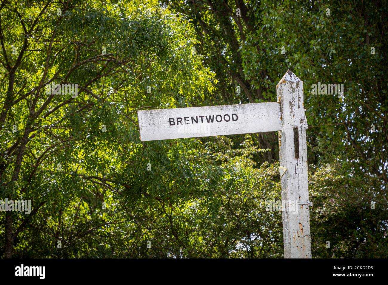 Brentwood wooden road sign Stock Photo - Alamy