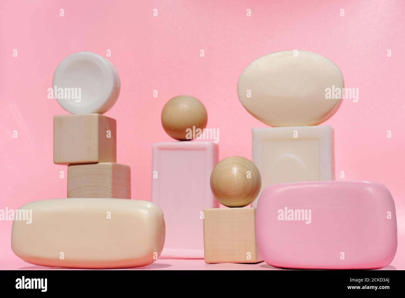 trendy soap set design on a pink background. natural soap bars and ...