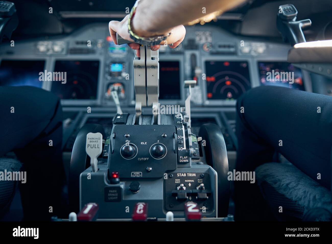 Captain hand accelerating on the throttle in commercial airplane Stock ...