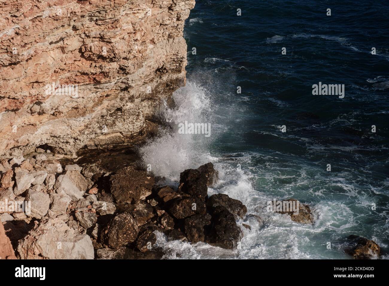 Ocean wave background breaking sea water rocky shore rough seas ...