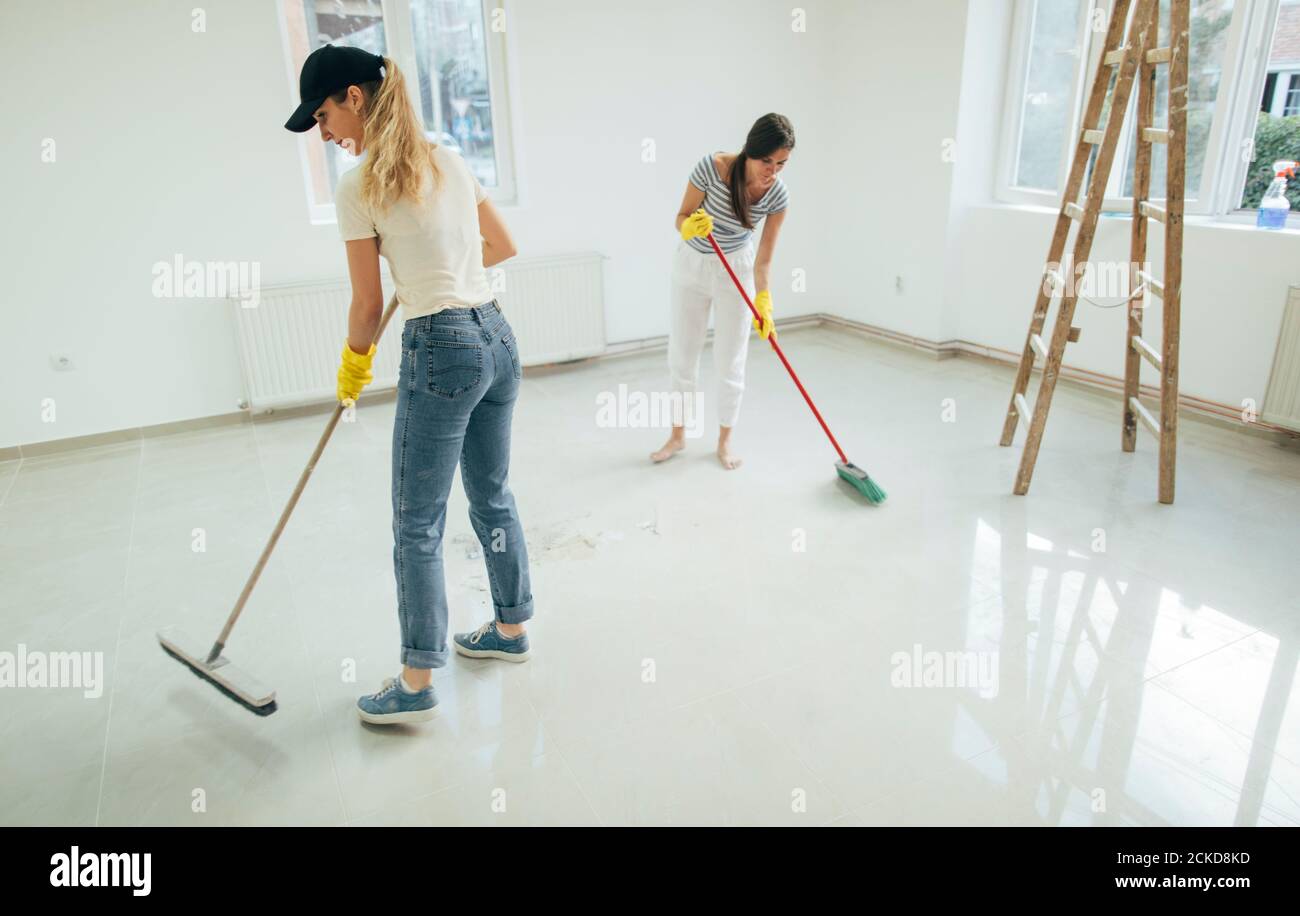 Woman cleaning floor with brush Stock Photo - Alamy