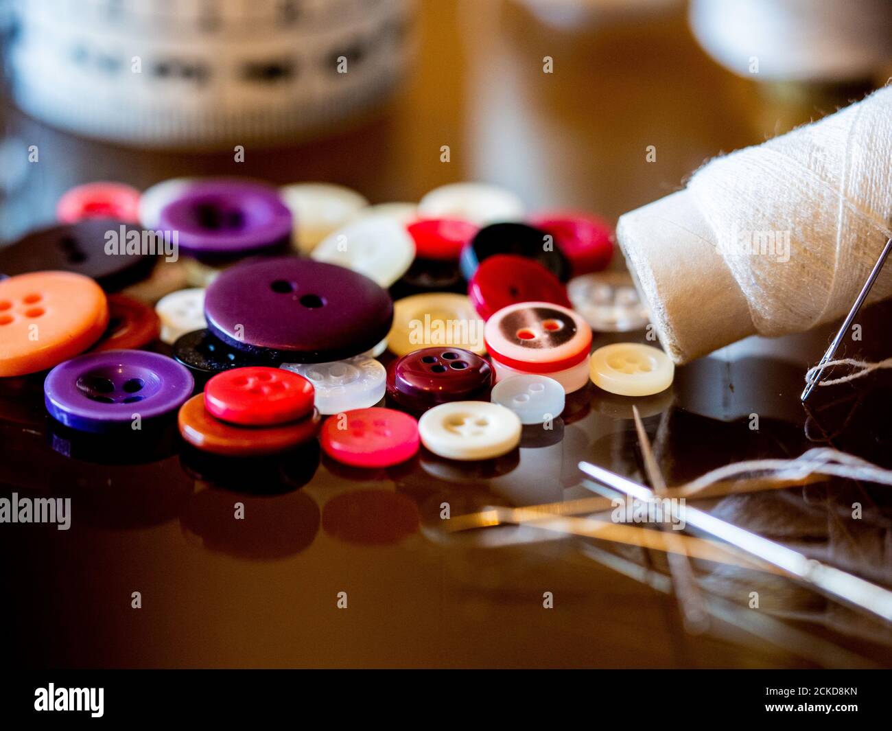 Still life of sewing items on a glass background Stock Photo - Alamy
