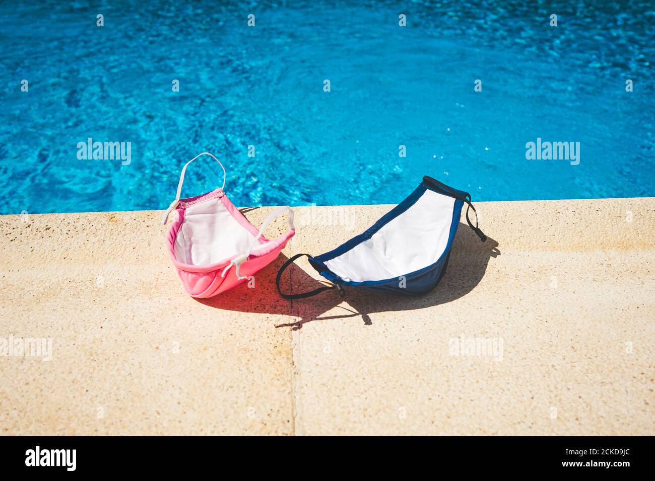 Protective mask near a swimming pool in summer Stock Photo - Alamy