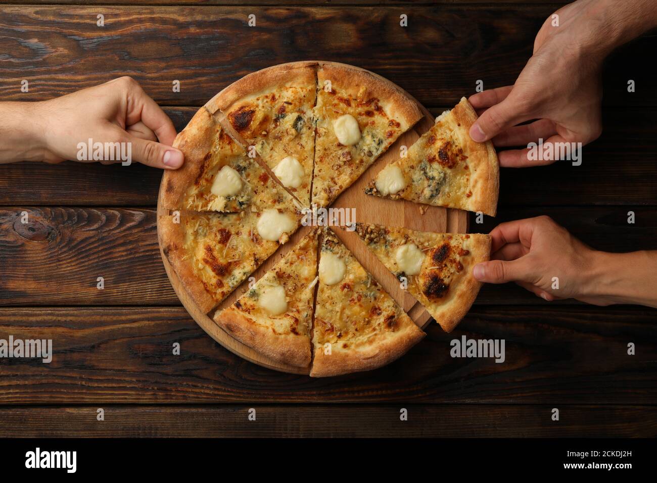 Pizza slices hands hi-res stock photography and images - Alamy