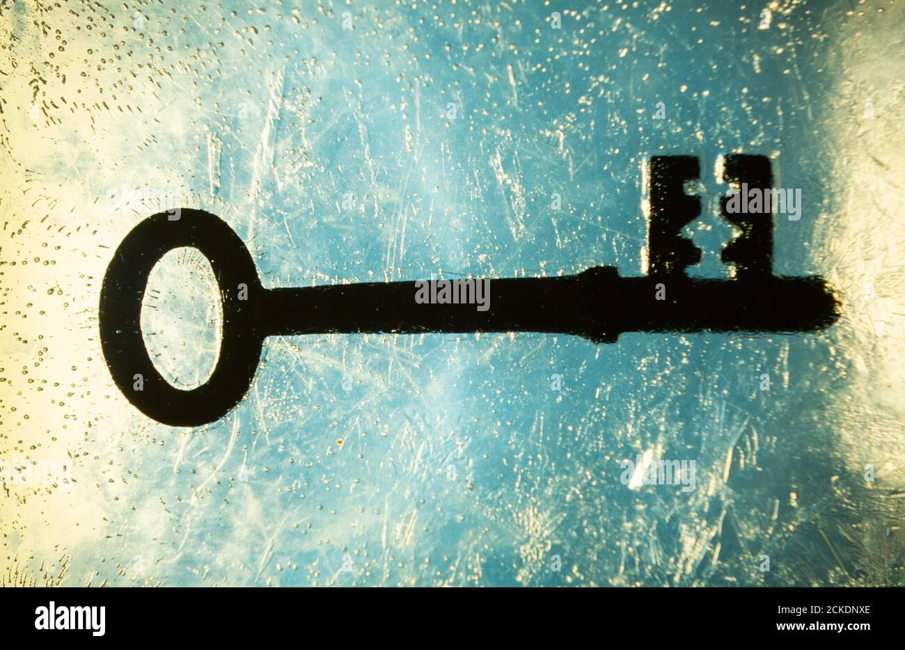 A large key locked in ice Stock Photo - Alamy