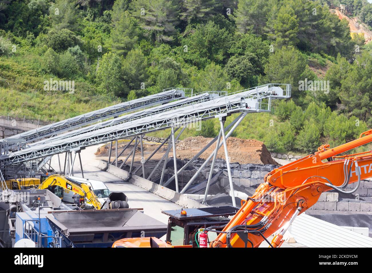 Industrial machinery working and transporting stone and various ...