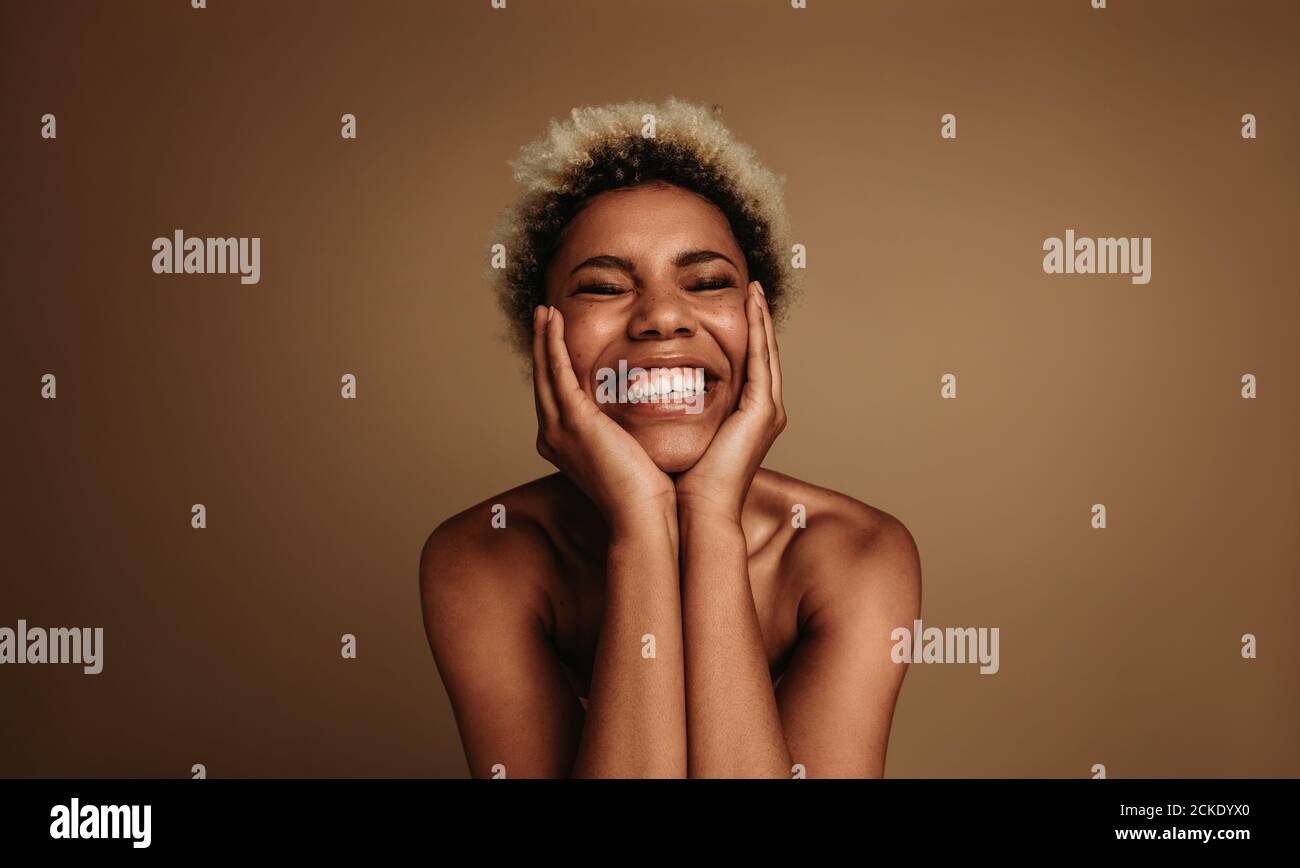 Hands on cheek hi-res stock photography and images - Alamy