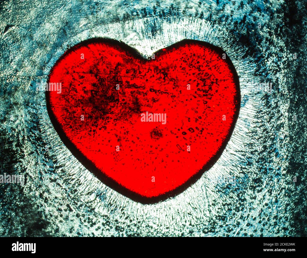 A glass heart frozen in ice Stock Photo - Alamy