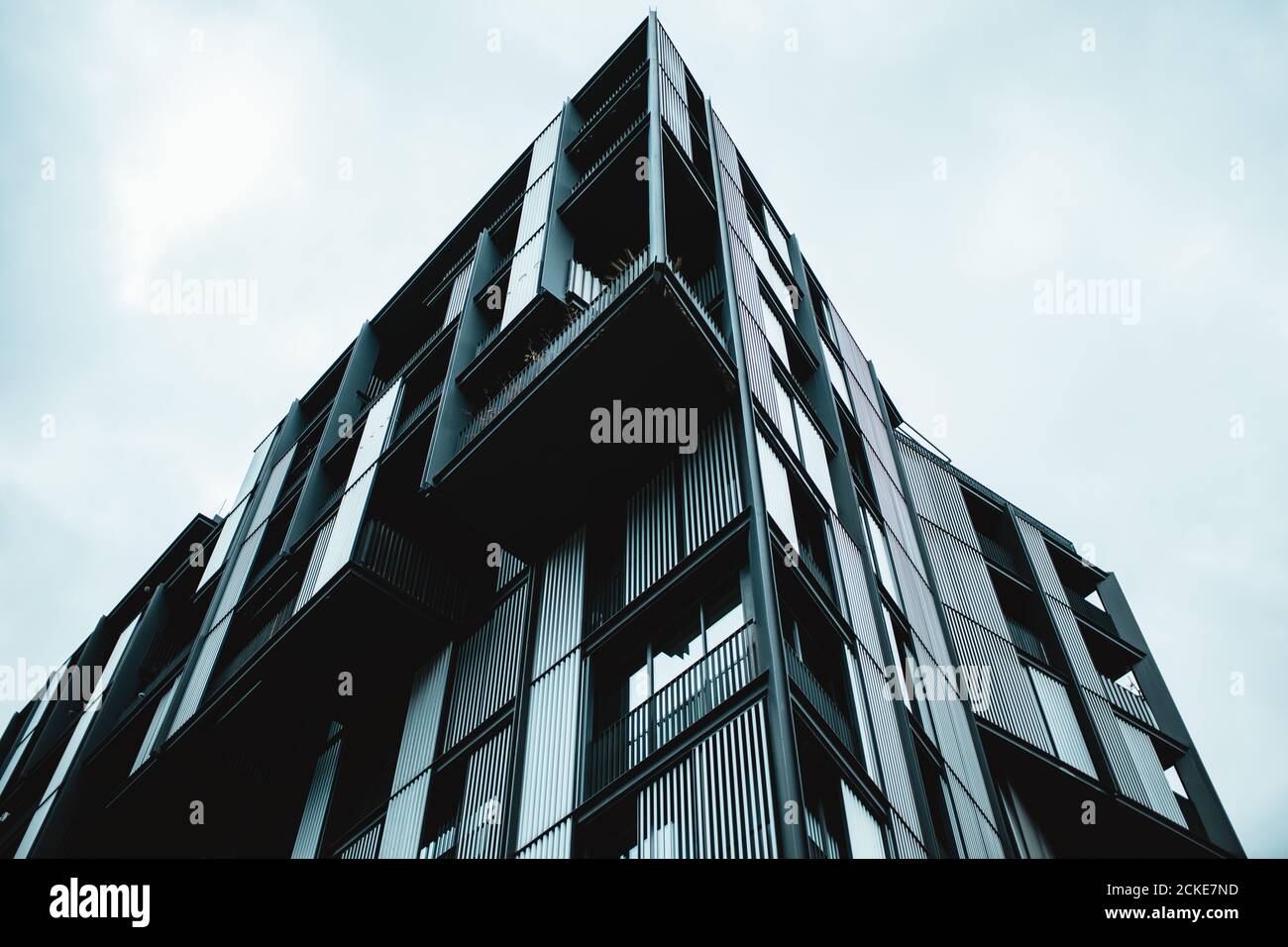 Low angle shot of a modern building with glass windows Stock Photo - Alamy