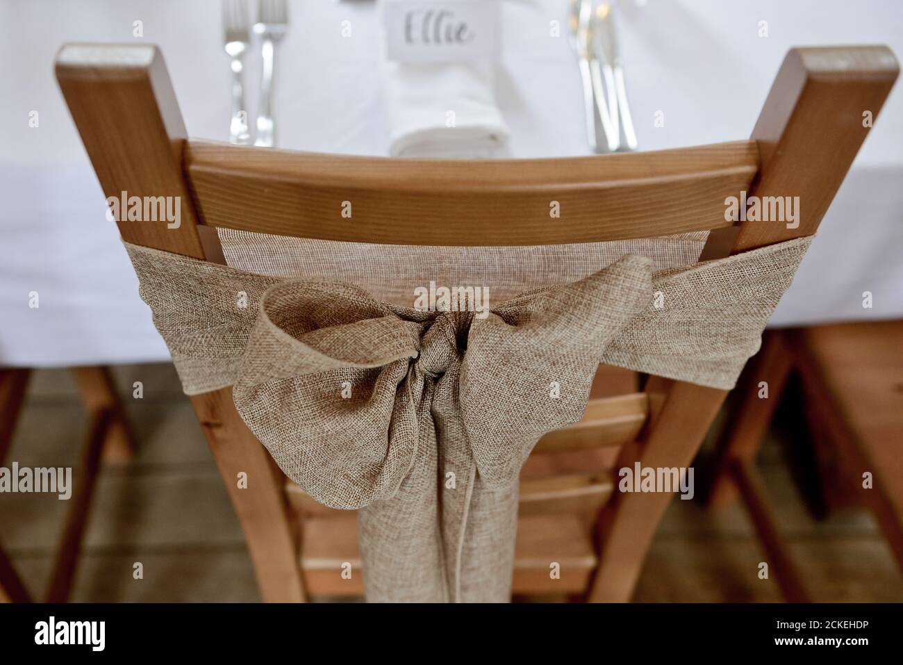 Wooden Chair with Hessian Bow tied to back shot from above close up ...
