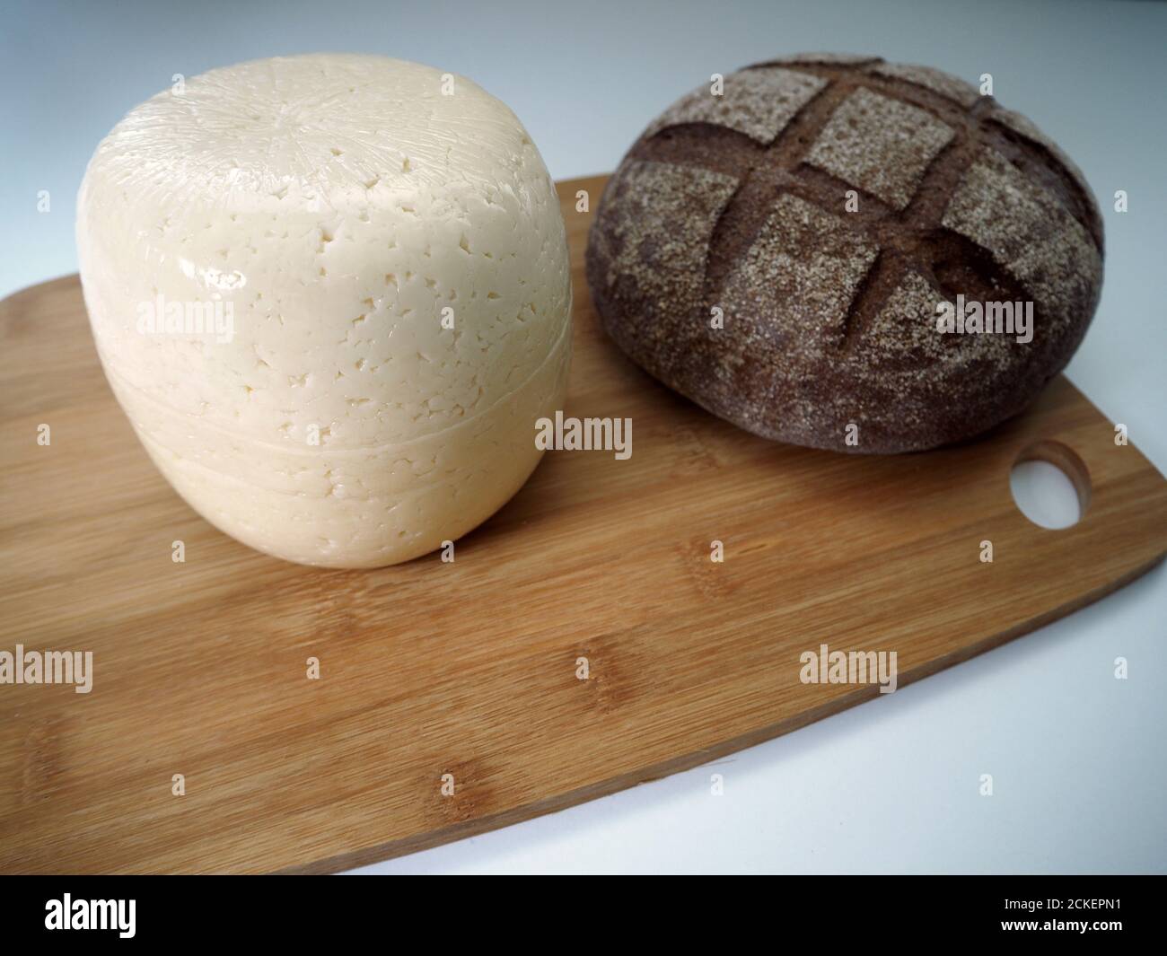 The cheese is a round head with bread Stock Photo - Alamy
