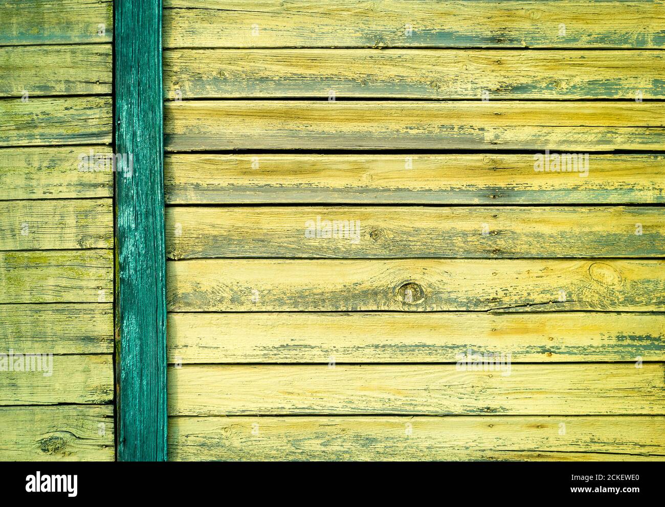 Green old painted cracked wooden door texture as background. Closeup ...