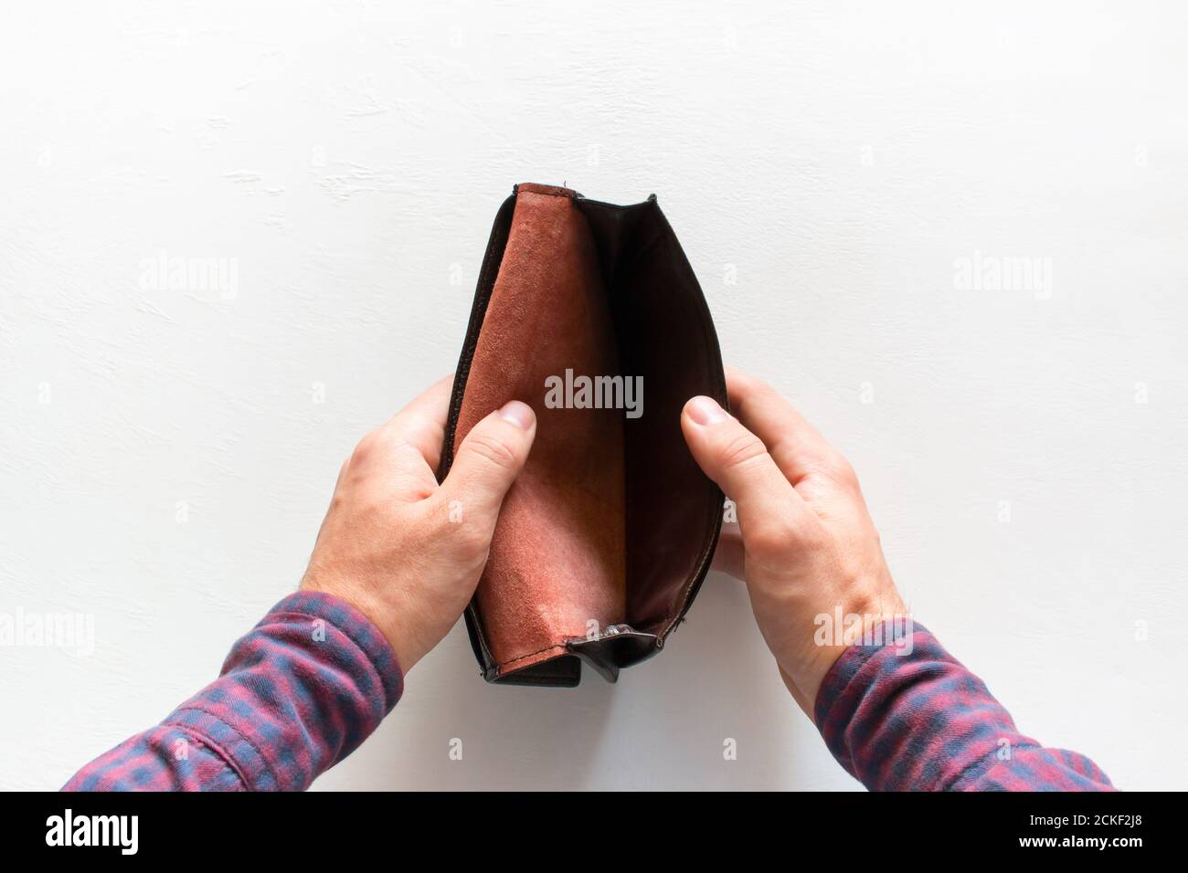 the man shows an empty purse with no money. concept of poverty Stock ...