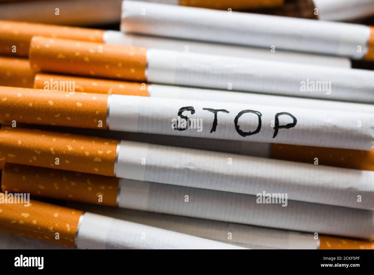 inscription stop on a cigarette. stop smoking concept Stock Photo - Alamy