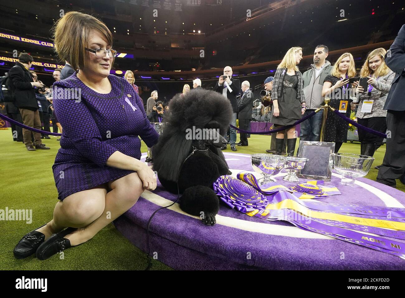 Dog handler Crystal poses with Siba the Standard Poodle, winner of Best ...