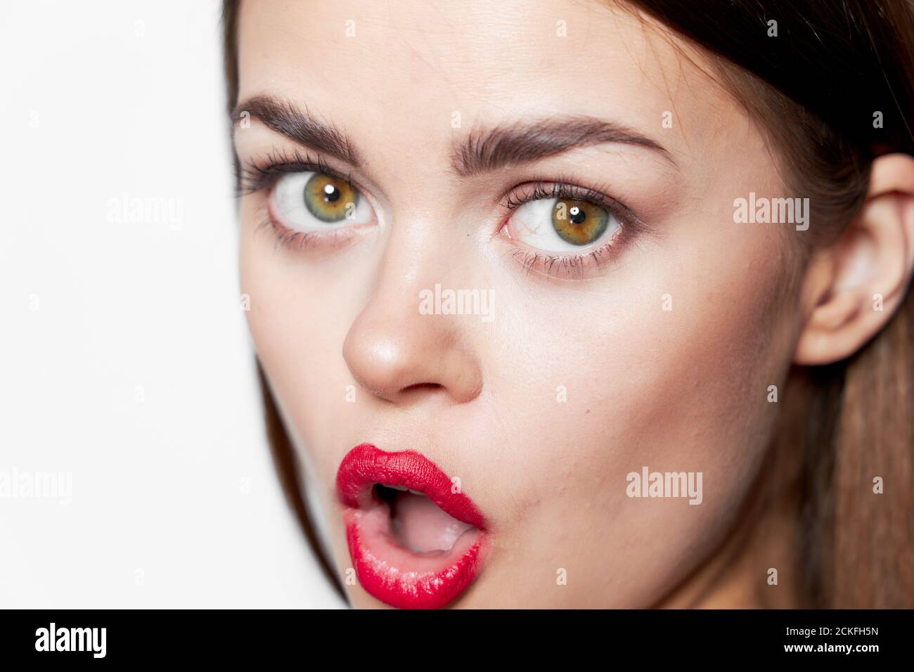 Close-up woman face with surprised open mouth facial Stock Photo - Alamy