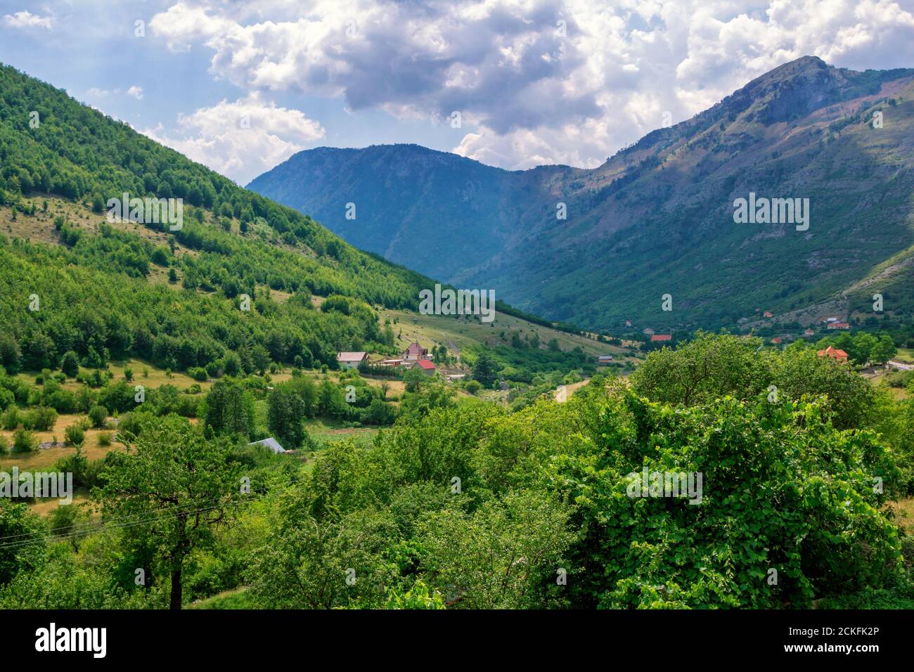 Summer landscape –Albanian mountains, covered with green trees, clouds ...