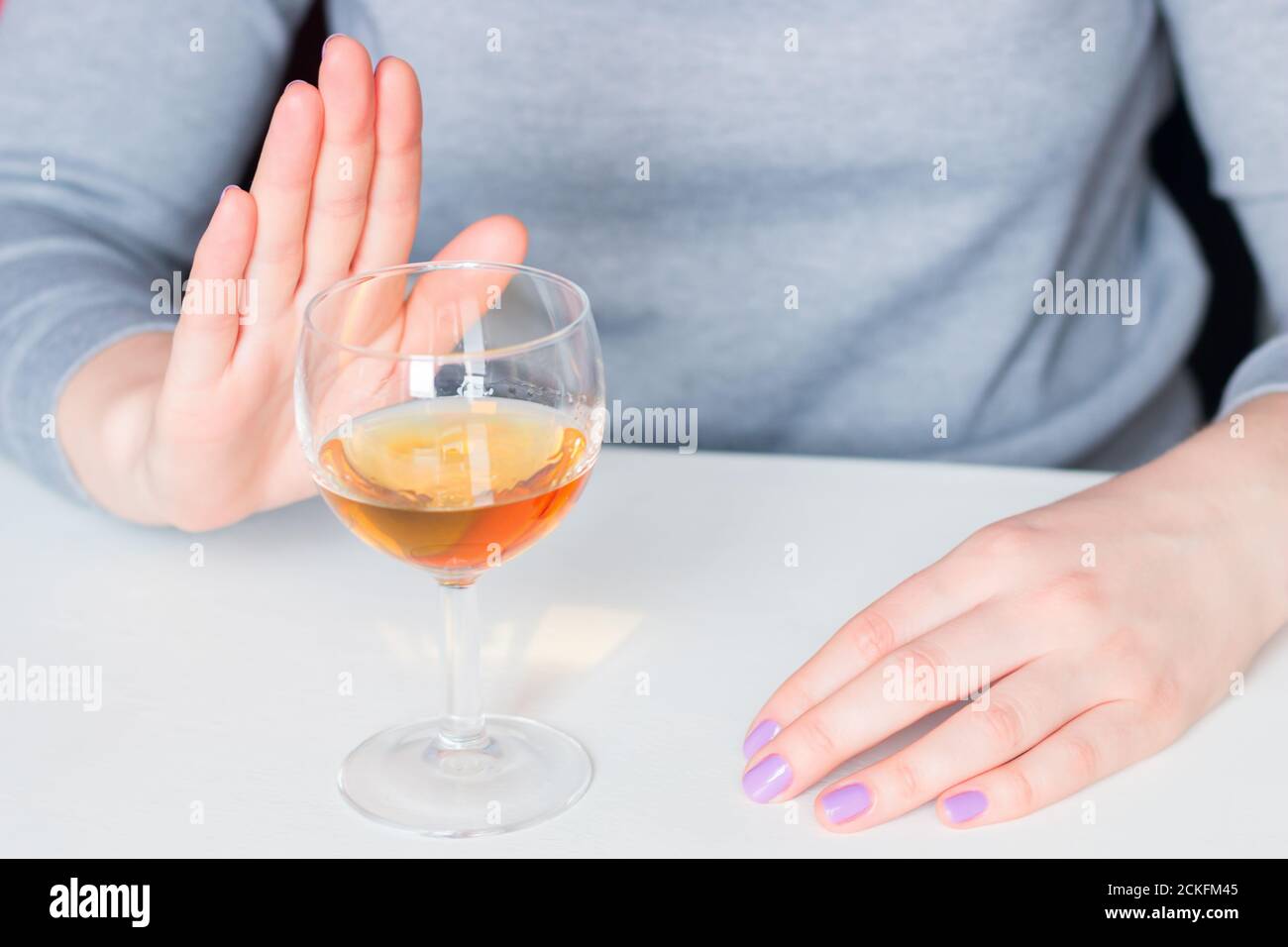 young woman refuses to drink alcohol Stock Photo - Alamy