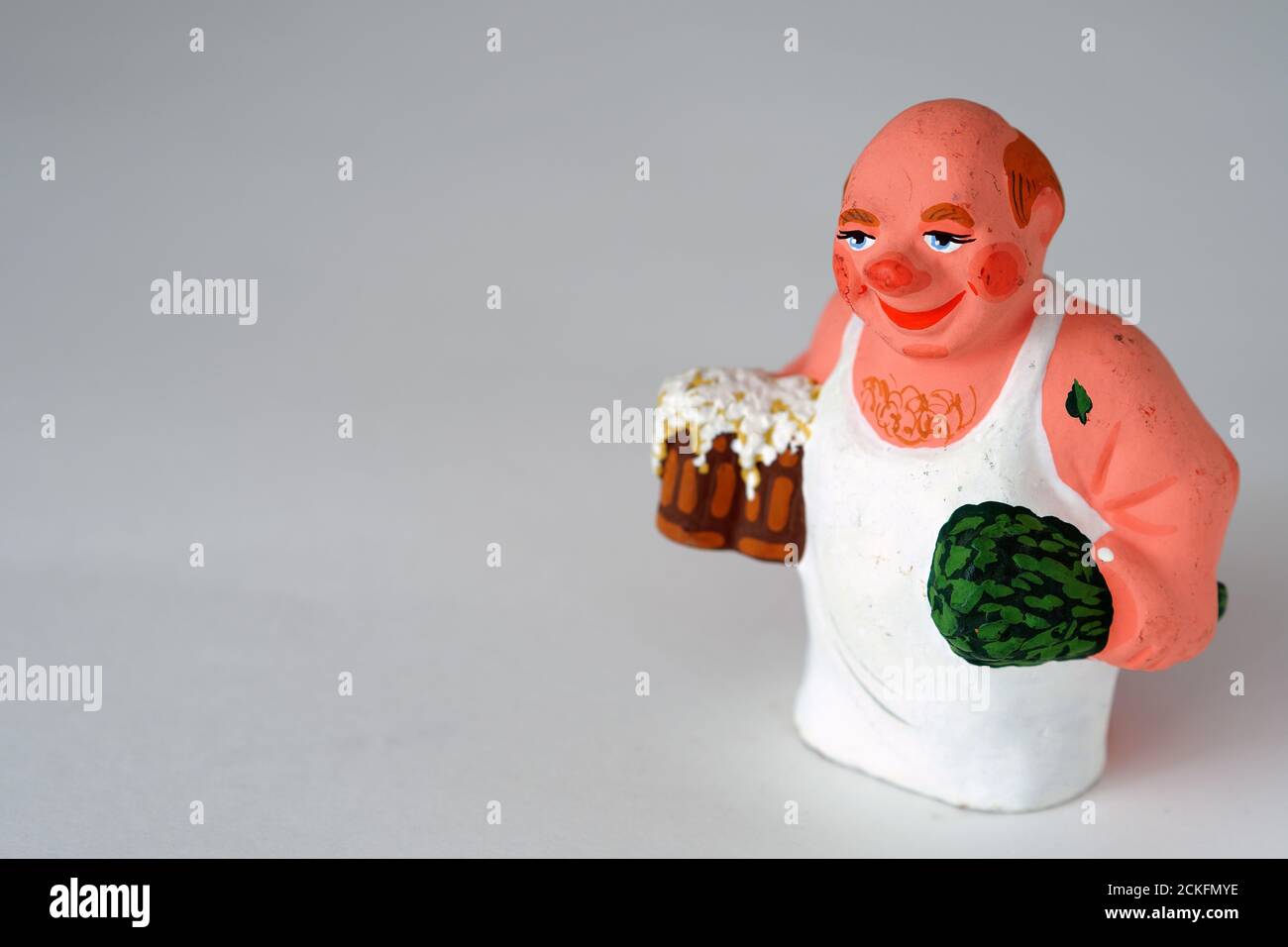 Funny figurines of ceramics, plaster and clay. The man in the bath ...