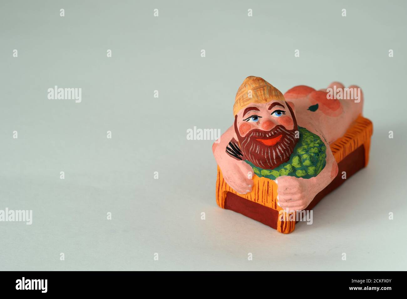 Funny handmade ceramic and clay figurines.The man in the bath.Souvenir ...