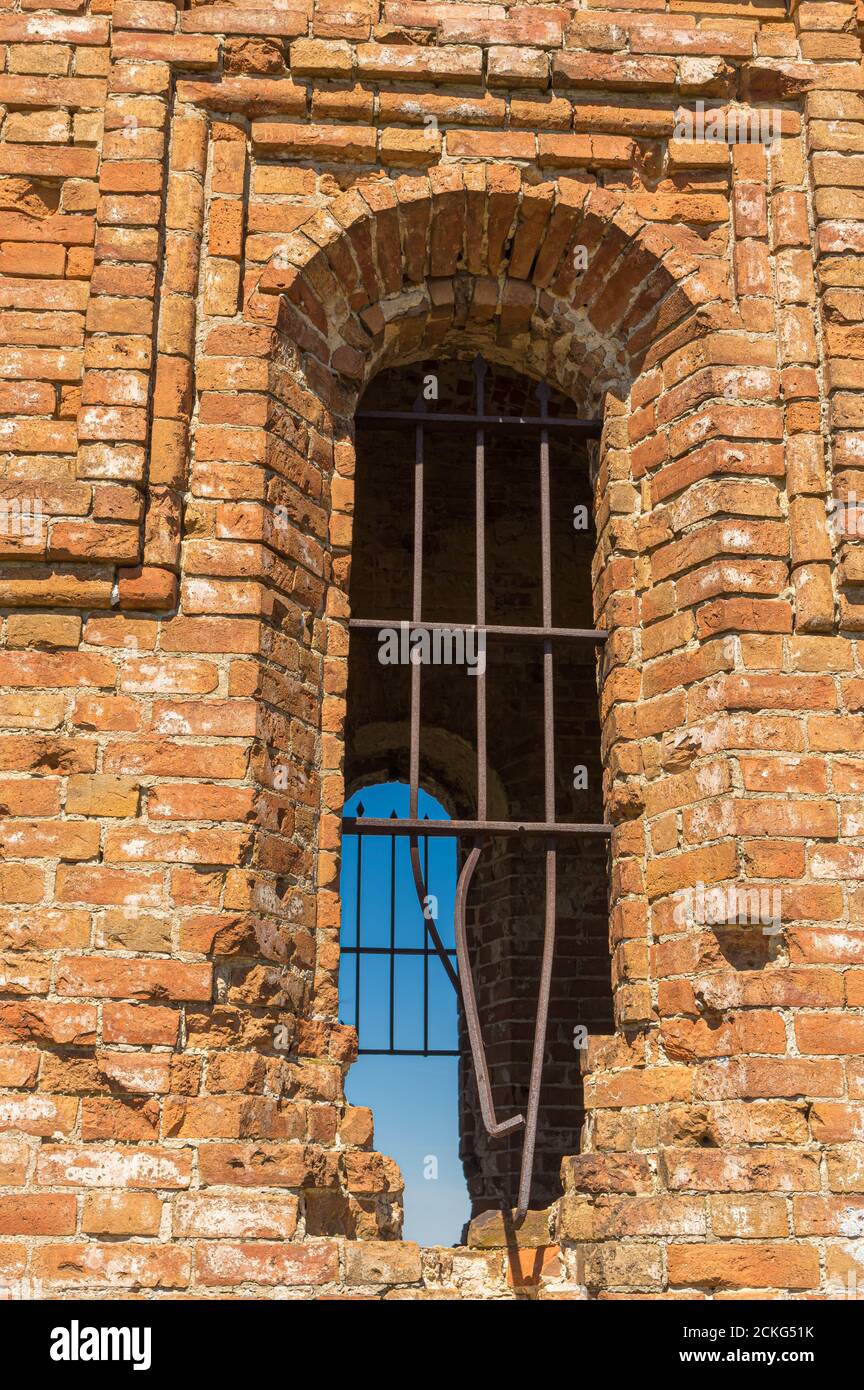 Ancient grated window in old brick building Stock Photo - Alamy