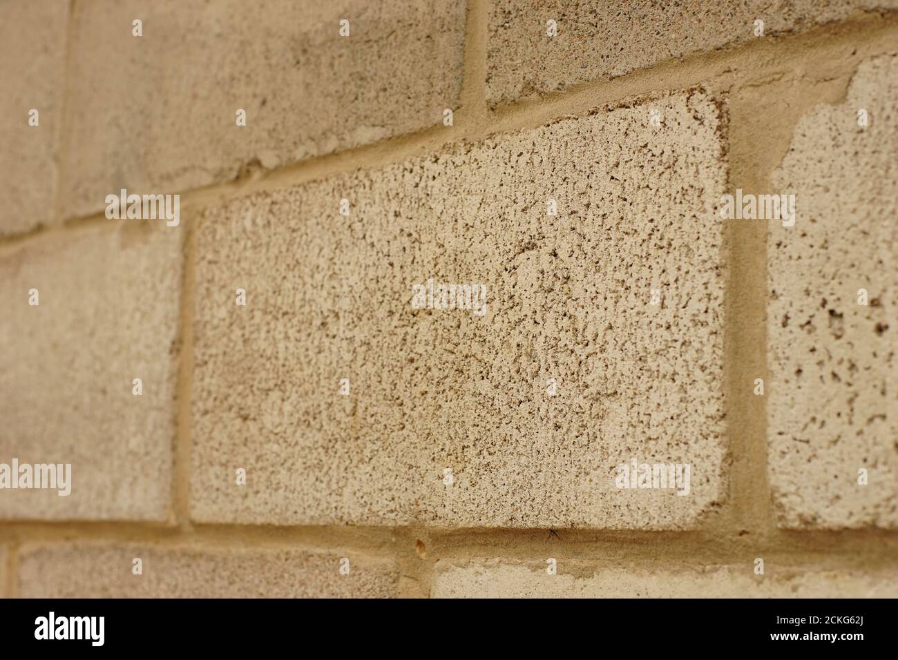 Wall of gray cinder block with old seams. Building's facade ...