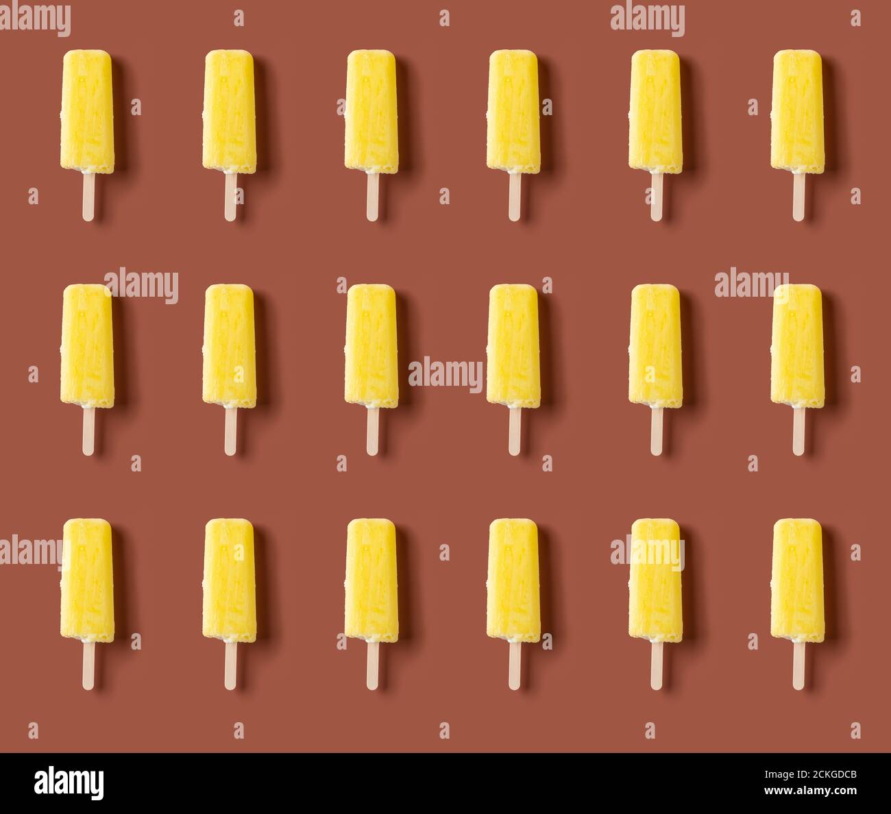 seamless yellow popsicle on a chocolate brown background Stock Photo ...
