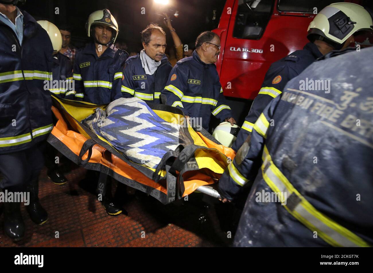 Firefighters carry victim on stretcher hi-res stock photography and ...