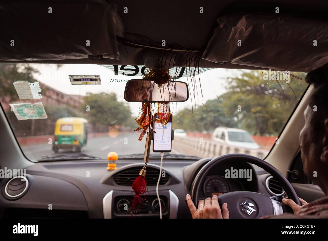 Agra / India - February 24, 2020: Reflection in rear view mirror of ...
