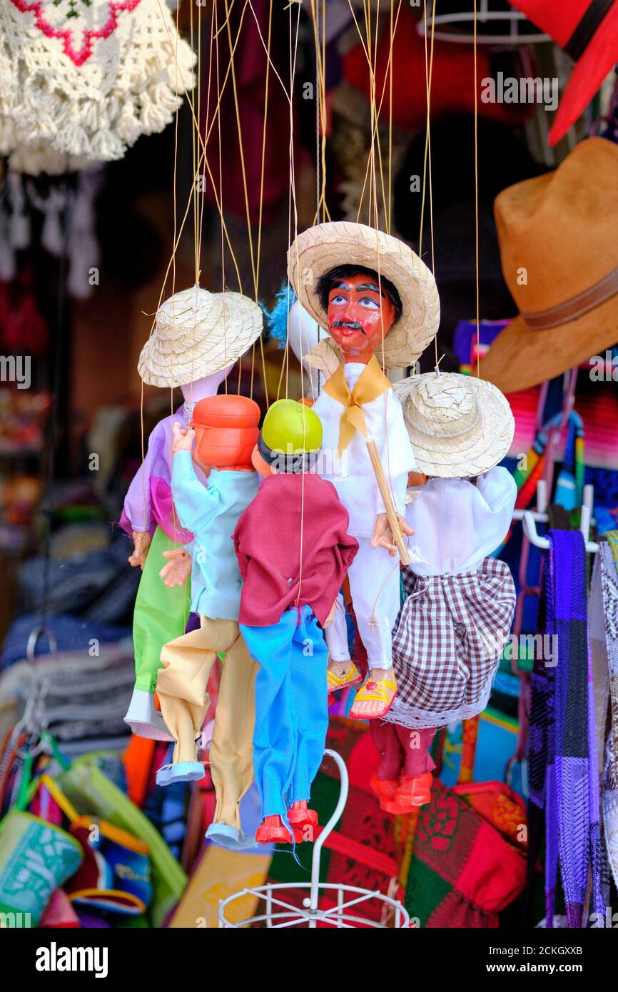 Display of marionettes on string of Mexican people in peasant outfits ...