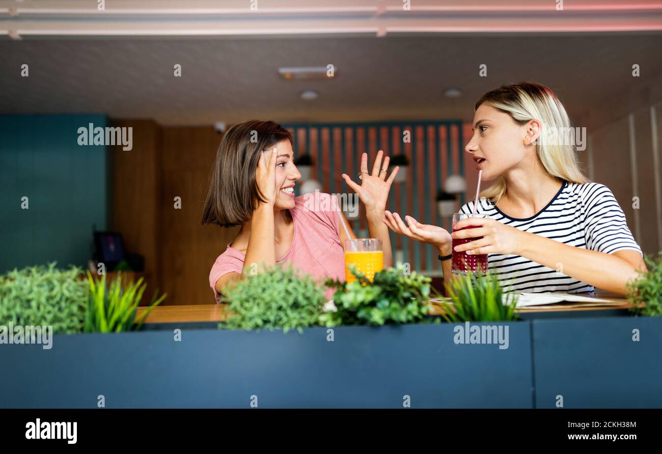 Happy beautiful women friends having fun, talking and smiling Stock ...