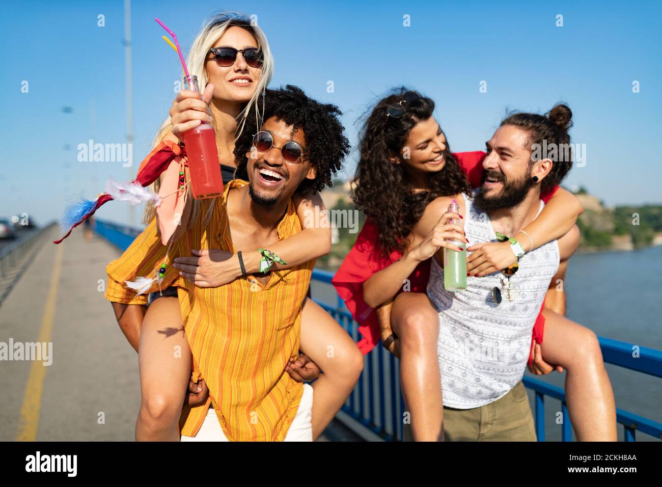 Group of happy friends people having fun together outdoors Stock Photo - Alamy